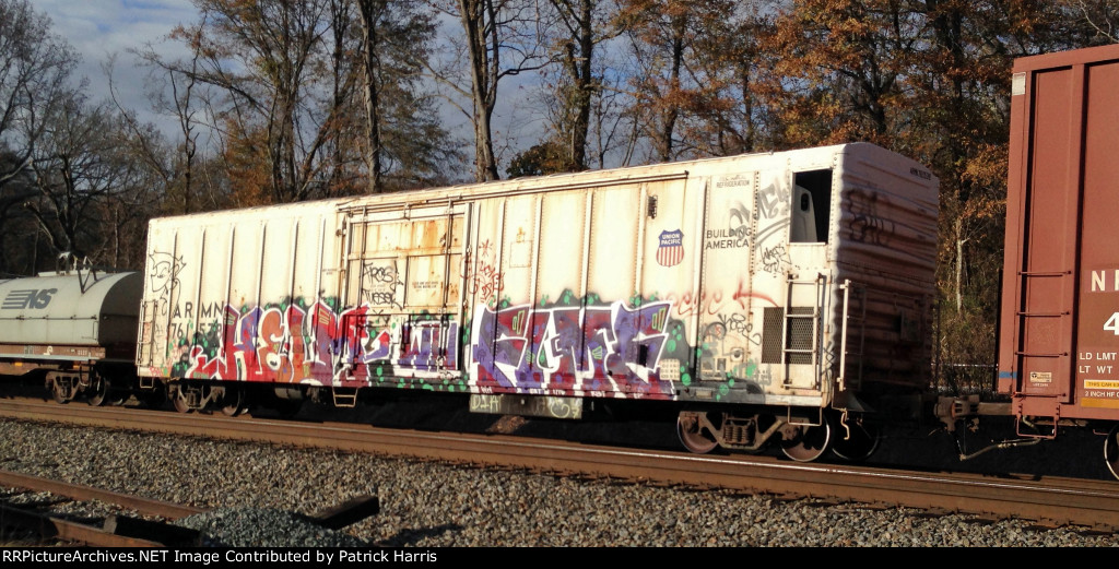 ARMN 761538 57-foot mechanical reefer redbuilt with removable refrigeration unit eastbound on NS ...